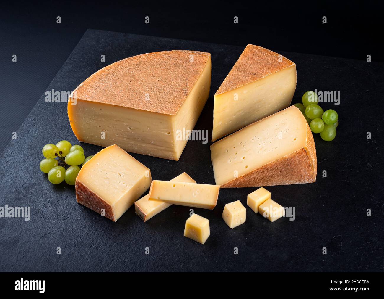Traditional aged mountain cheese of the Alps offered as close-up with ...