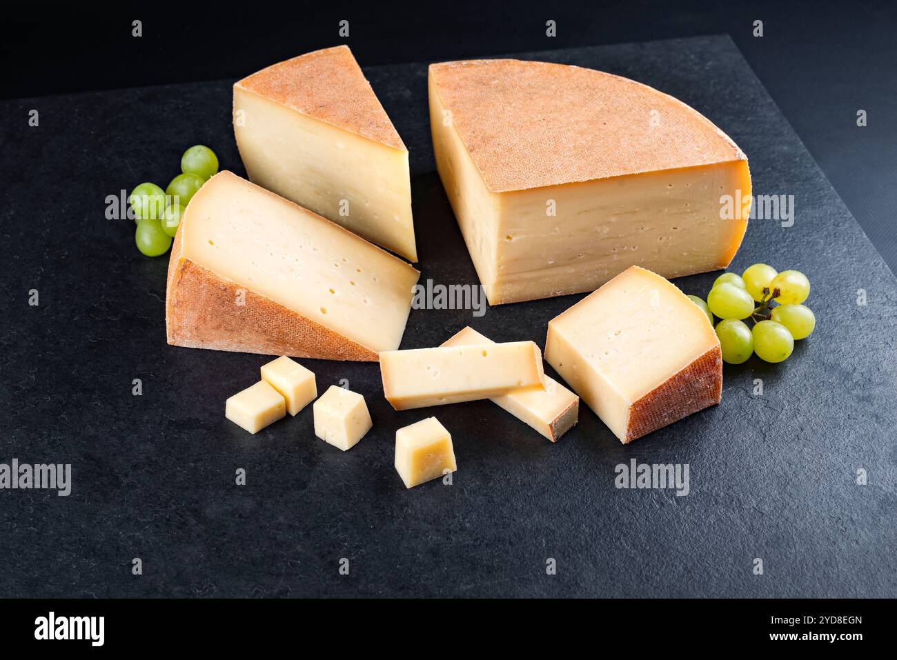 Traditional aged mountain cheese of the Alps offered as close-up with ...