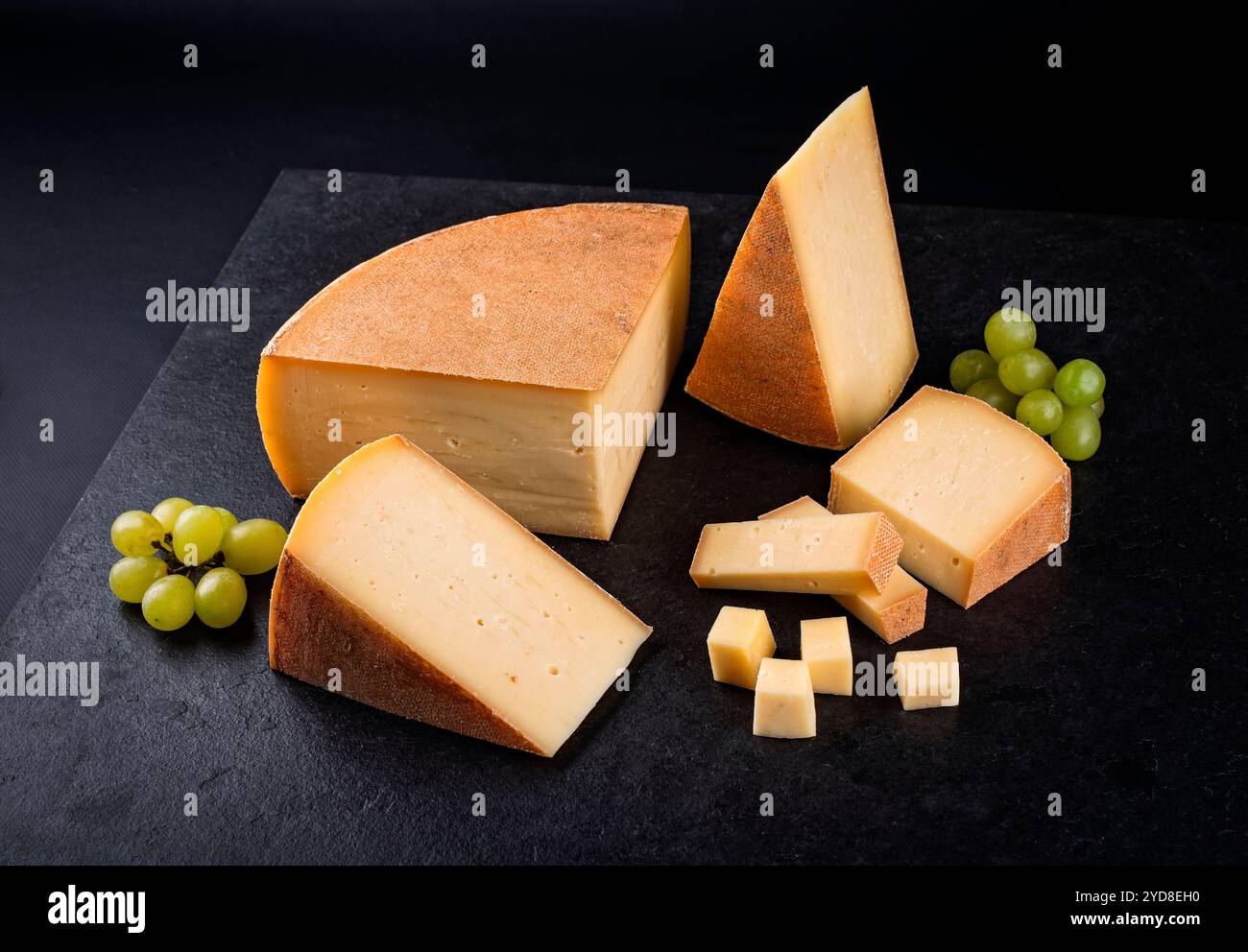 Traditional aged mountain cheese of the Alps offered as close-up with ...