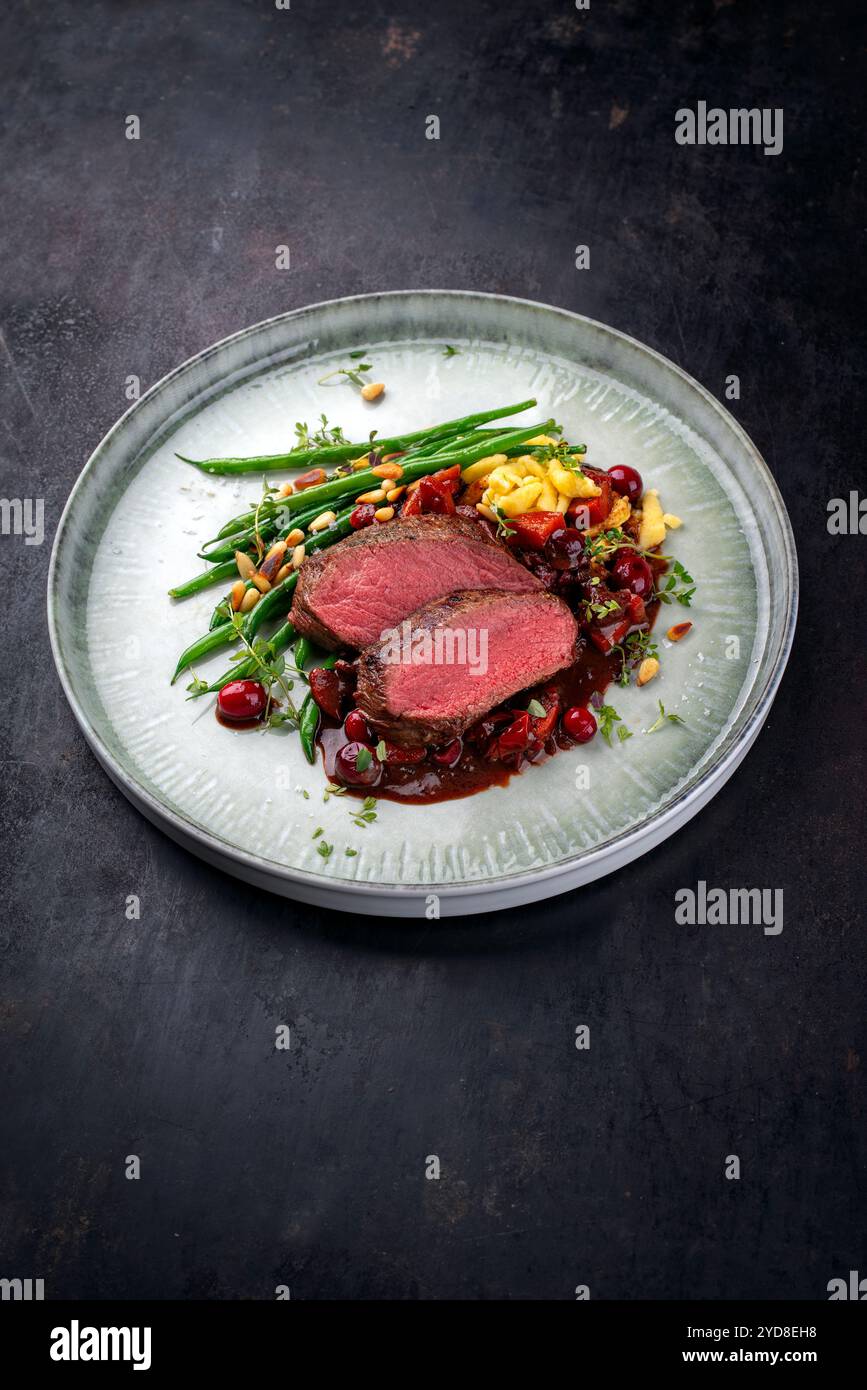 Traditionally roasted saddle of venison fillet with spÃ¤tzle Stock ...