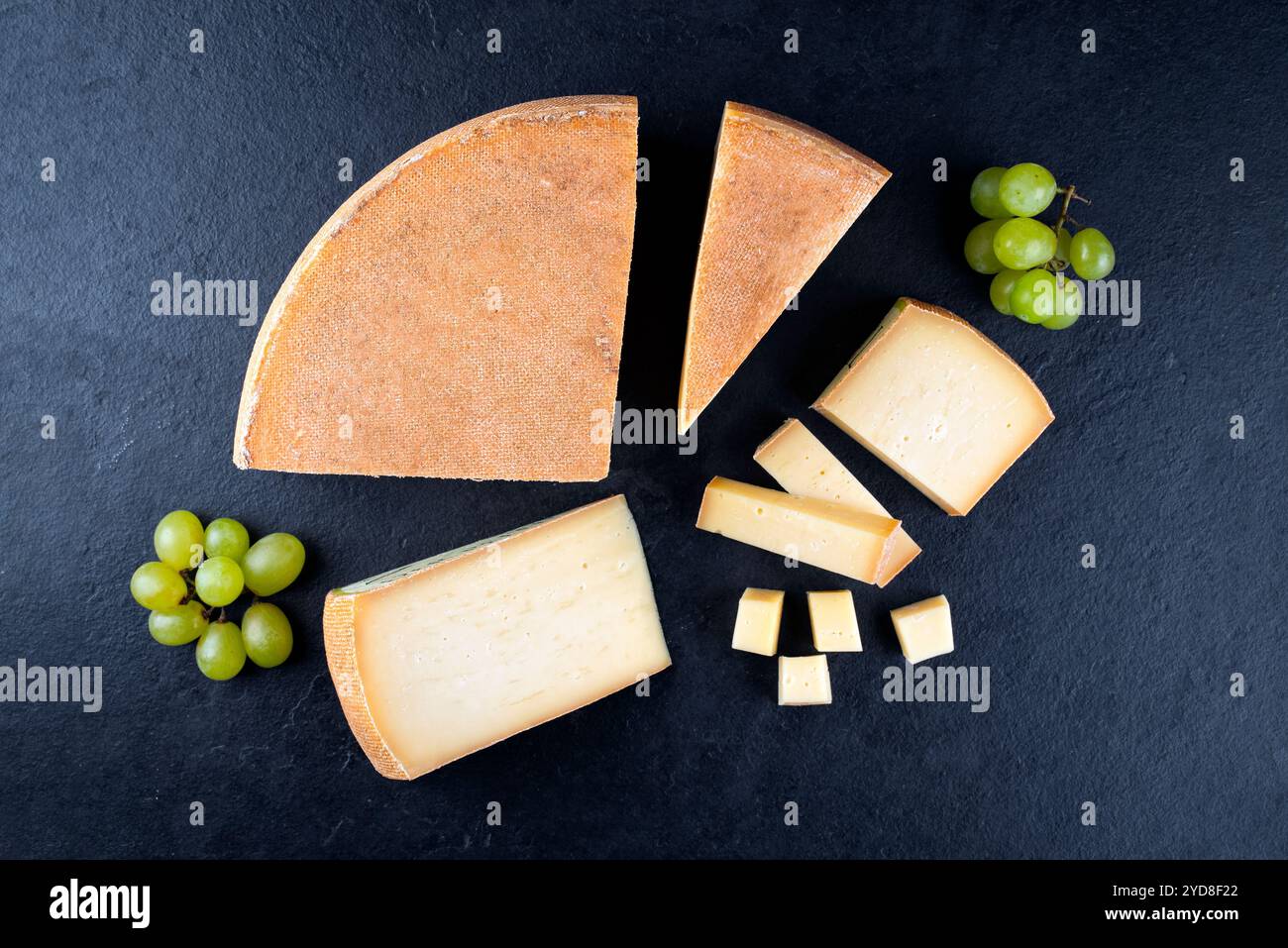 Traditional aged mountain cheese of the Alps offered as top view with ...