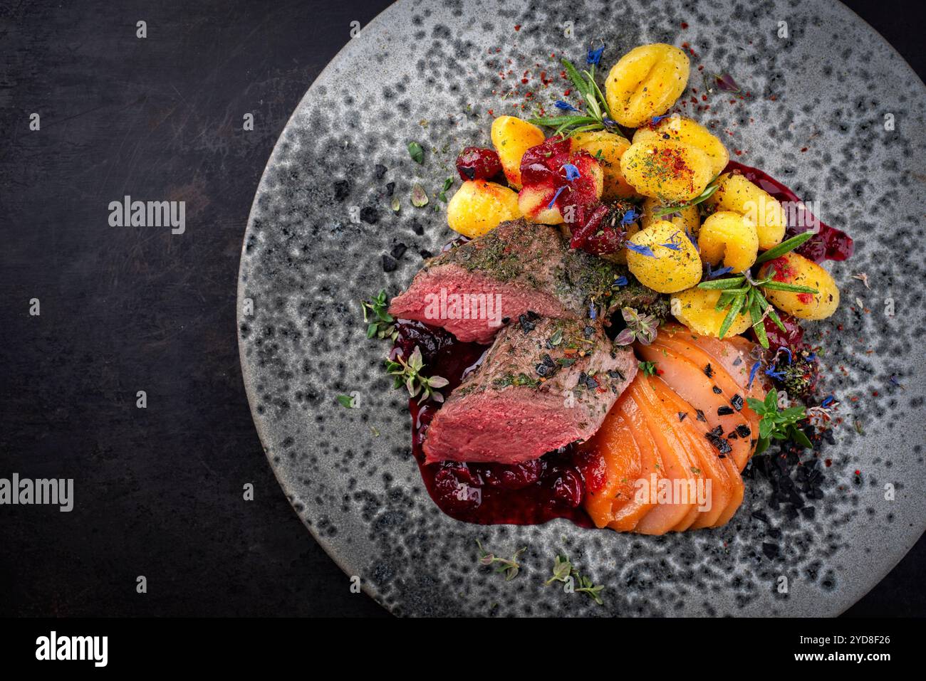 Traditional fried venison back filet with saturated pear Stock Photo ...