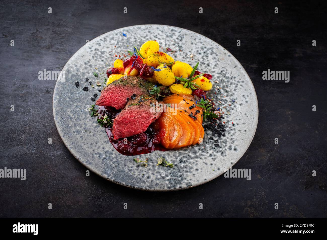 Traditional fried venison back filet with saturated pear Stock Photo ...