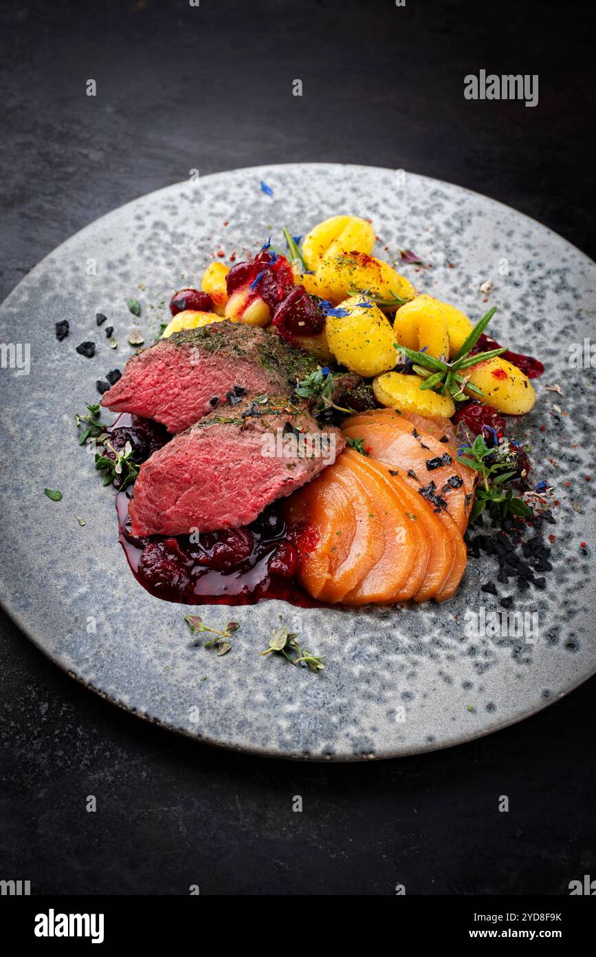 Traditional fried venison back filet with saturated pear Stock Photo ...