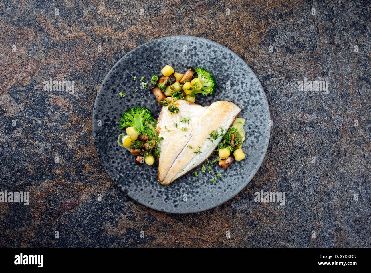Fried cod fillet with baby king oyster mushrooms Stock Photo - Alamy