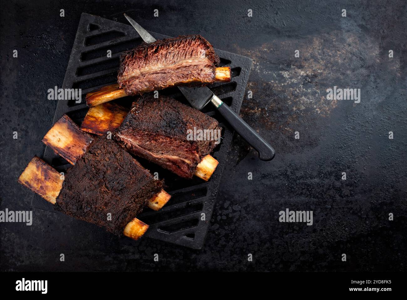 Traditional barbecue burnt chuck beef ribs marinated with spicy rub and ...