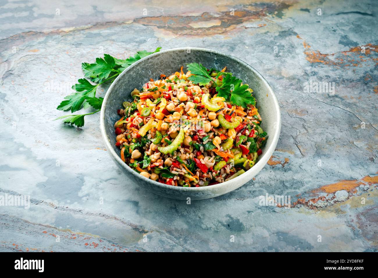 Traditional German wild rice salad with fresh chopped vegetables and ...