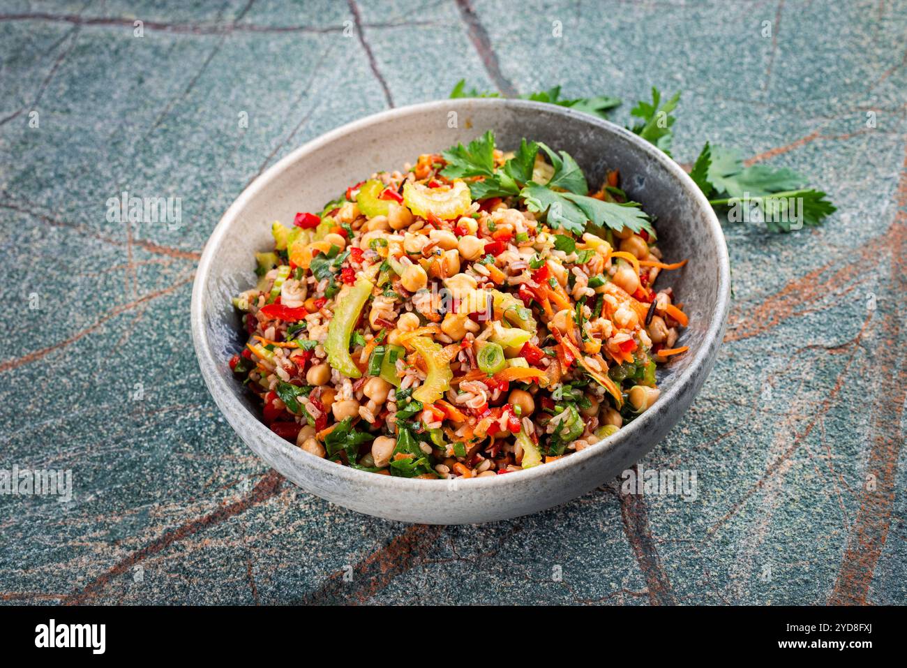 Traditional German wild rice salad with fresh chopped vegetables and ...