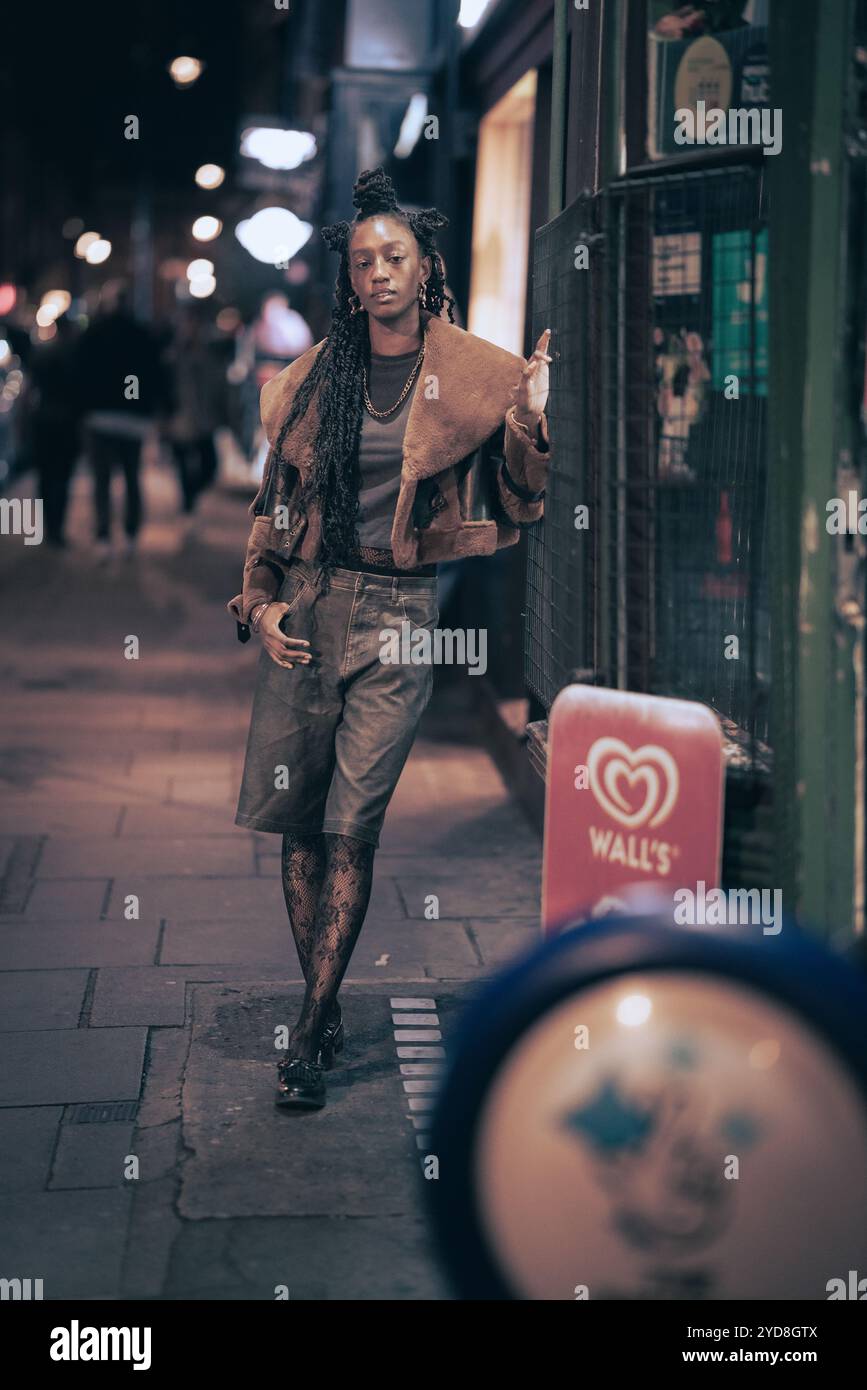 Black female model in Soho at night Stock Photo - Alamy