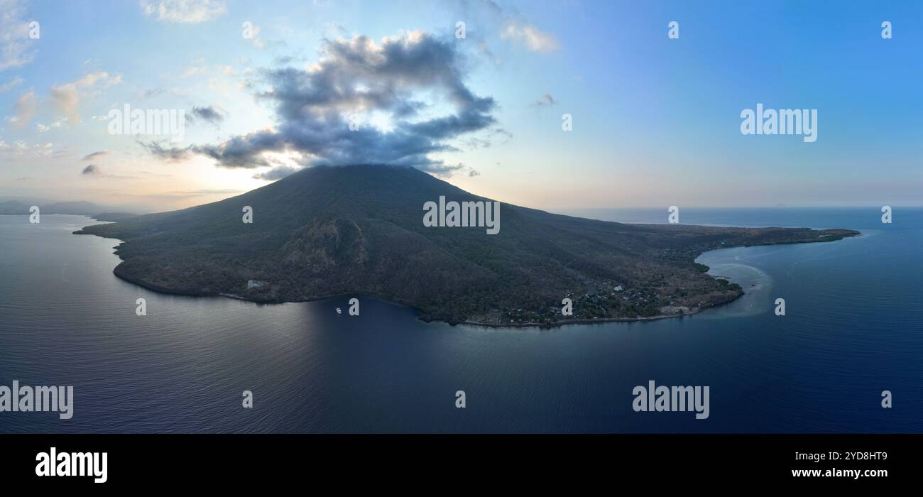 Evening light illuminates the volcano of Iliape on the island of ...