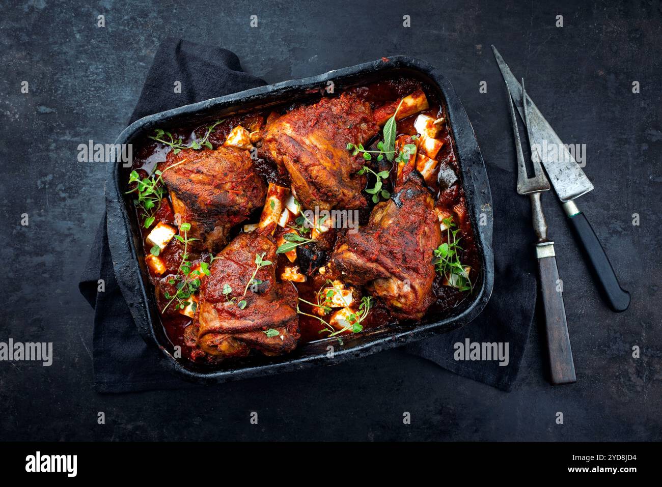 Traditional braised slow cooked lamb knuckle with eggplant and Greek ...