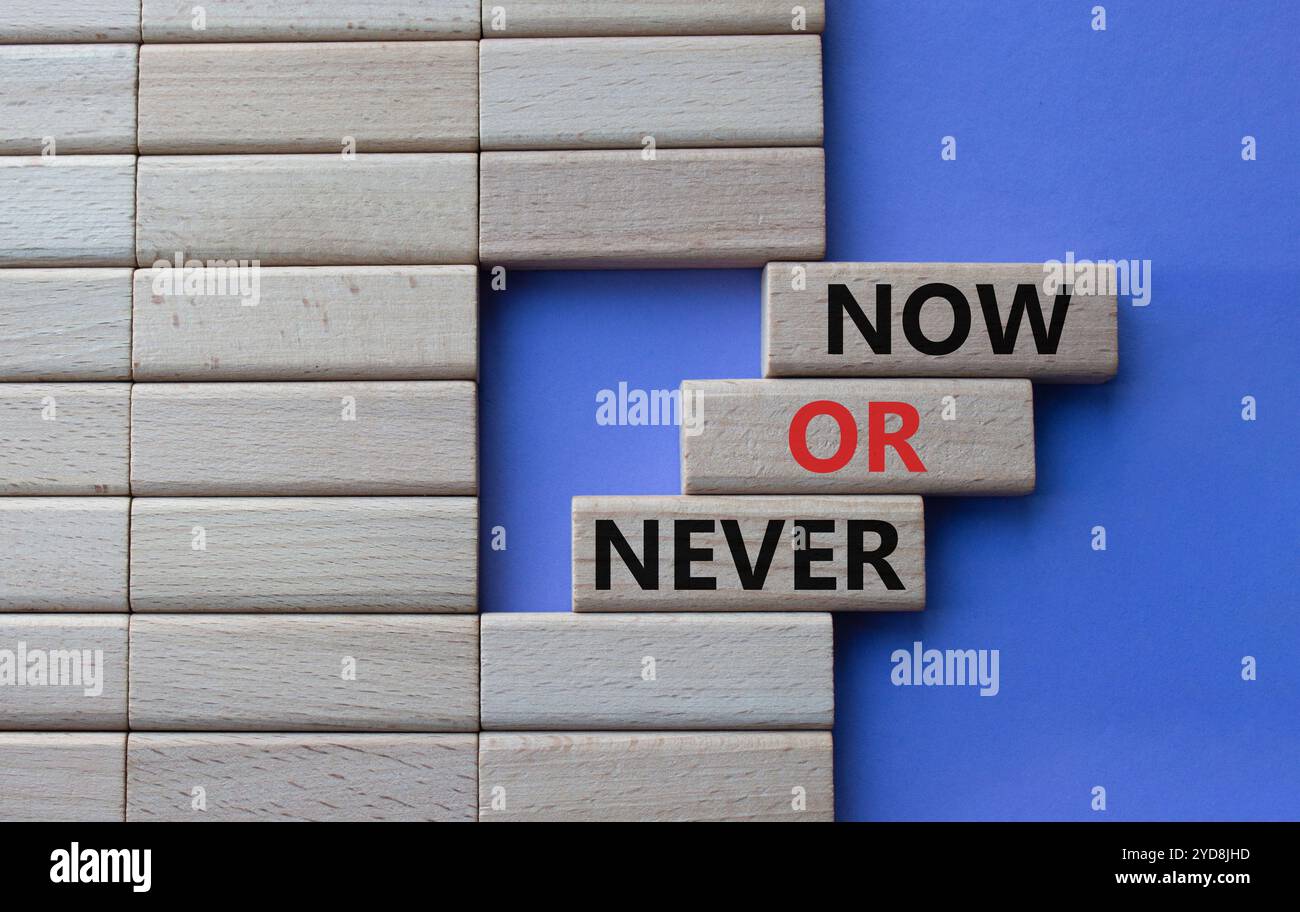 Now or Never symbol. Concept words Now or Never on wooden blocks ...