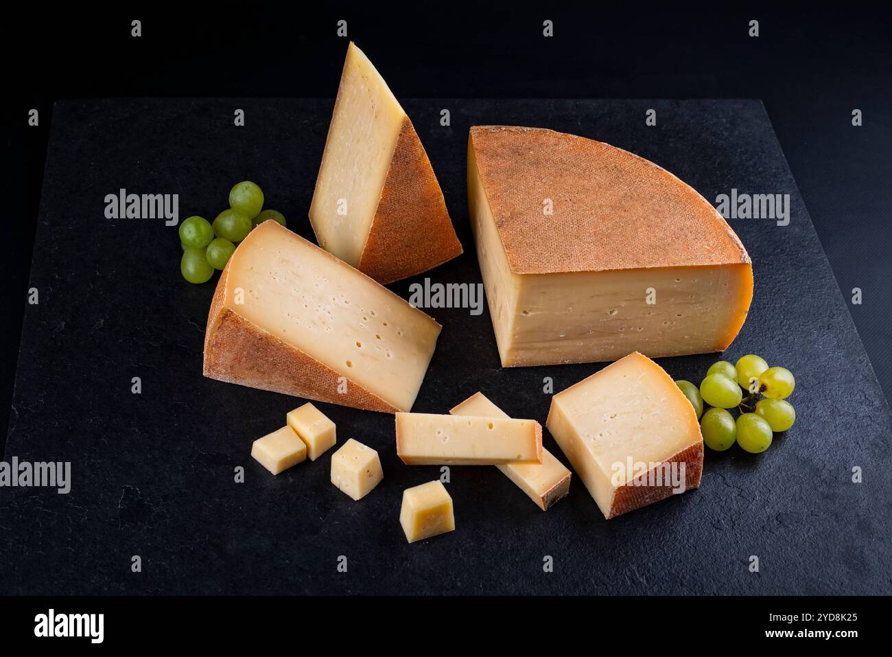 Traditional aged mountain cheese of the Alps offered as close-up with ...