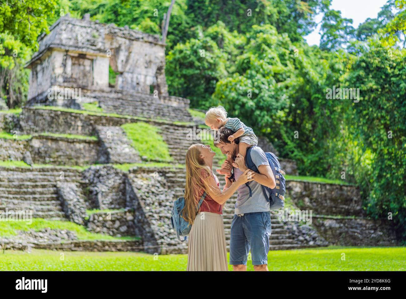 Mom, dad and baby son exploring the ancient pyramids of Palenque ...