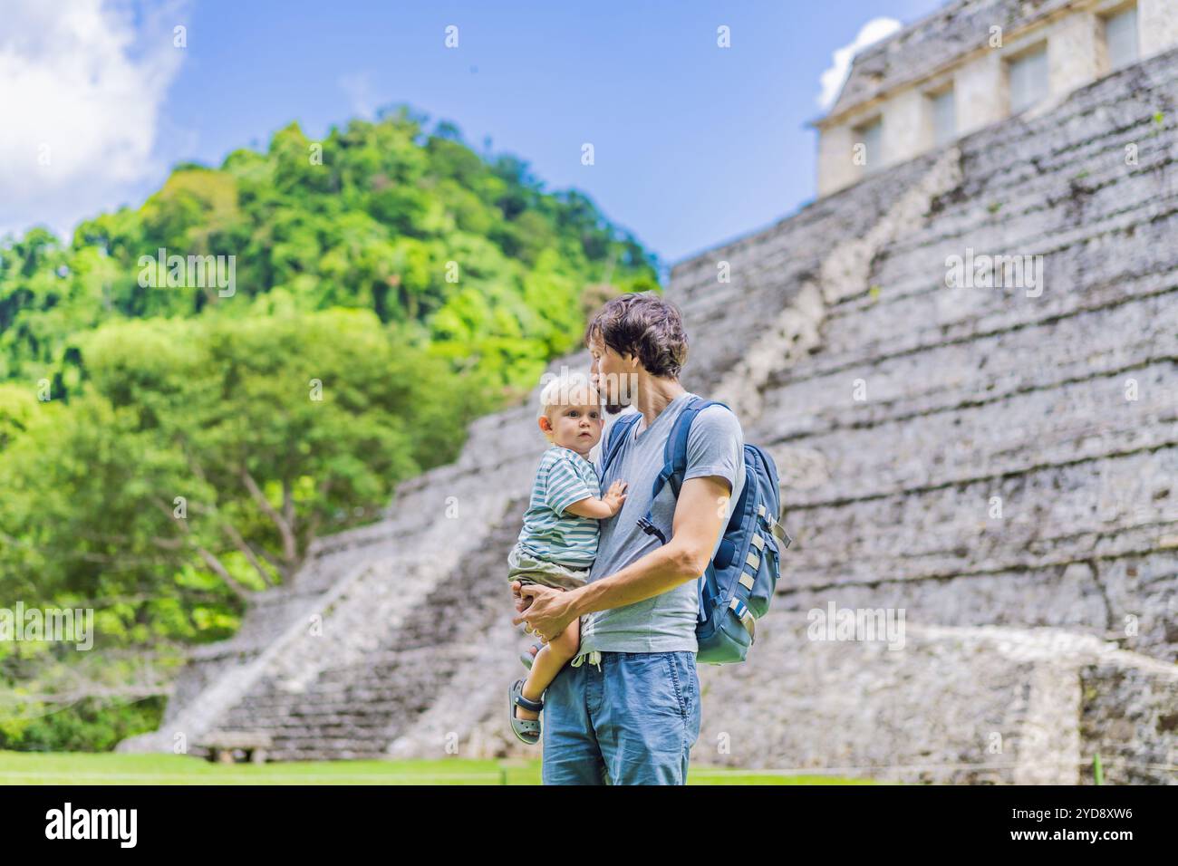 Father with his toddler son exploring the ancient pyramids of Palenque ...