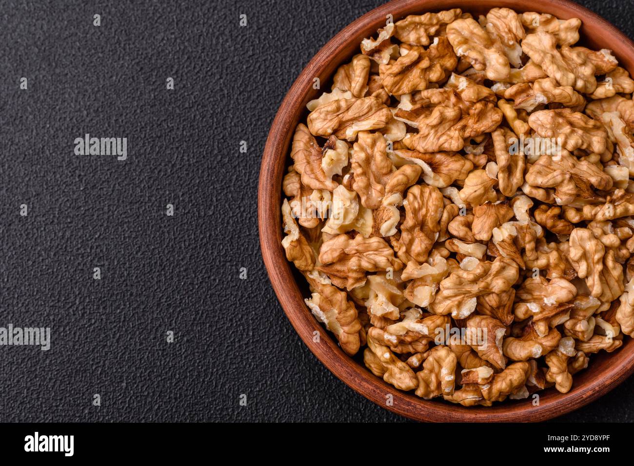 Delicious fresh peeled raw walnuts in a ceramic plate Stock Photo - Alamy