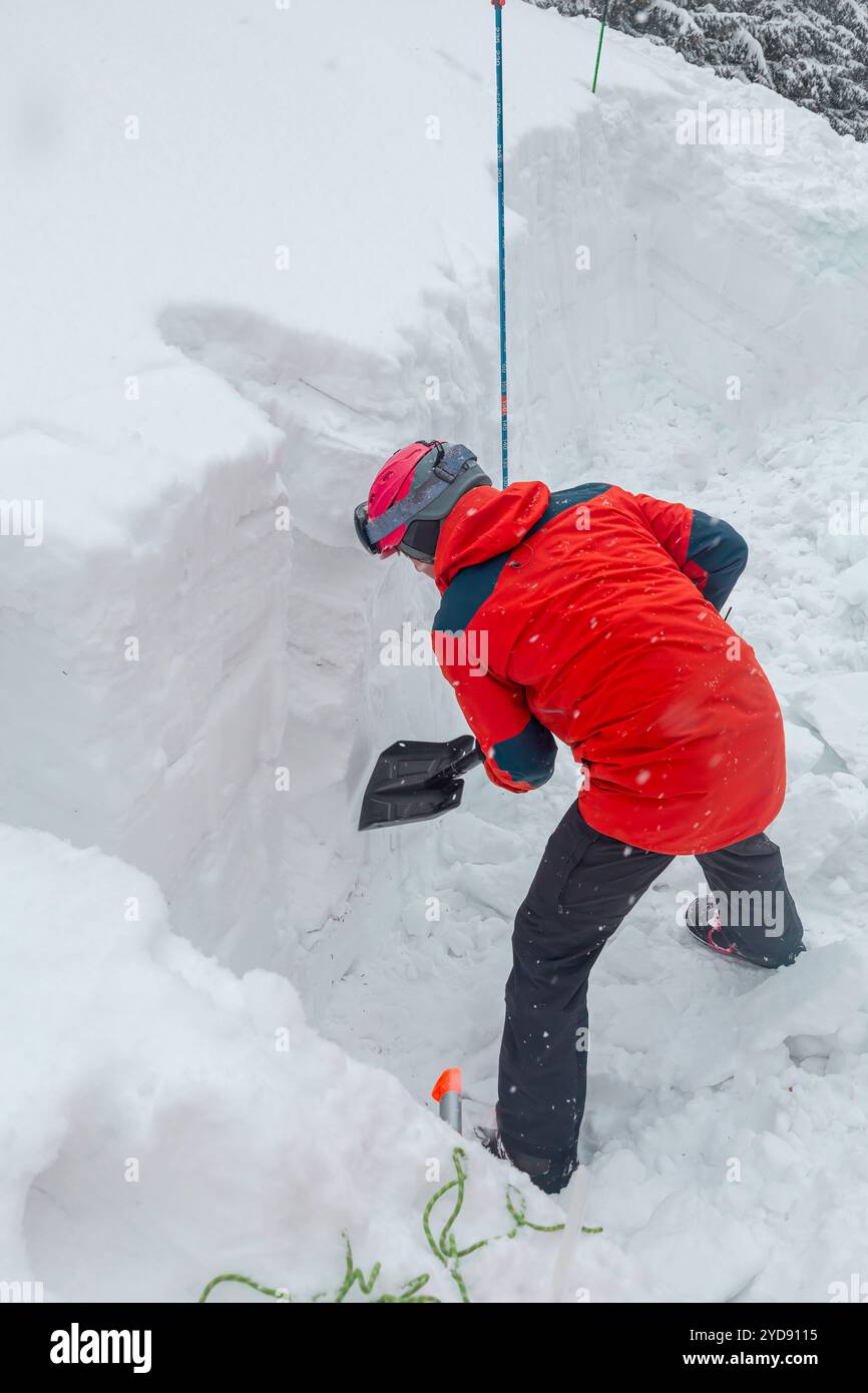 With shovel in hand, a backcountry explorer reads nature's winter diary ...