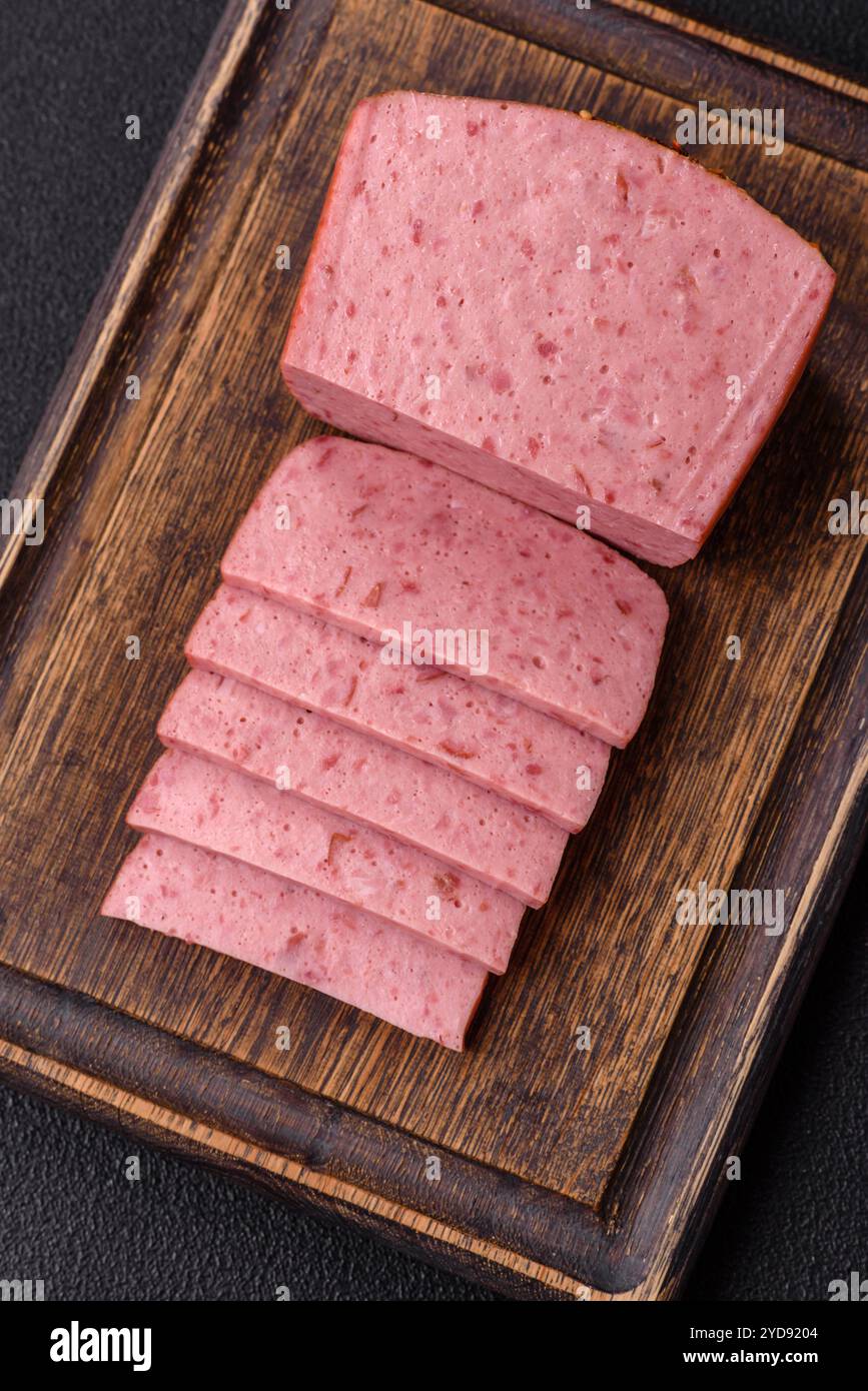 Delicious canned pink ham with salt, spices and herbs Stock Photo - Alamy