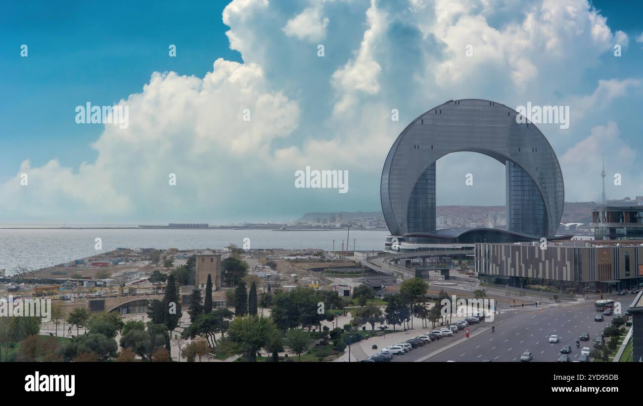 Baku, Azerbaijan - 14 Oct 2024: The Crescent Development Project against Baku's skyline ...