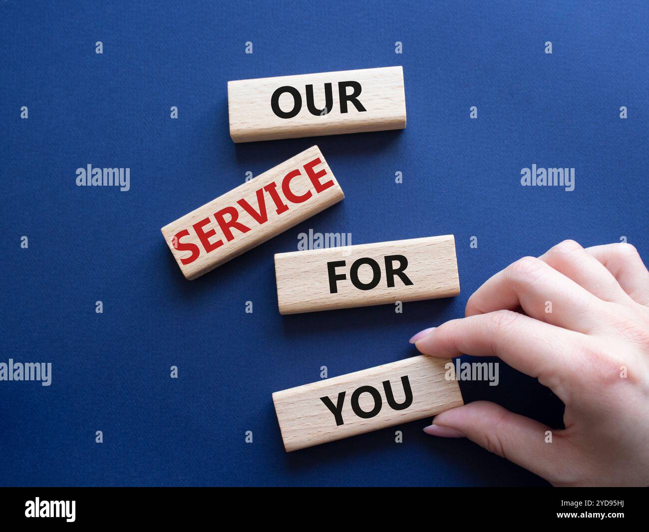 Our service for you symbol. Wooden blocks with words Our service for ...
