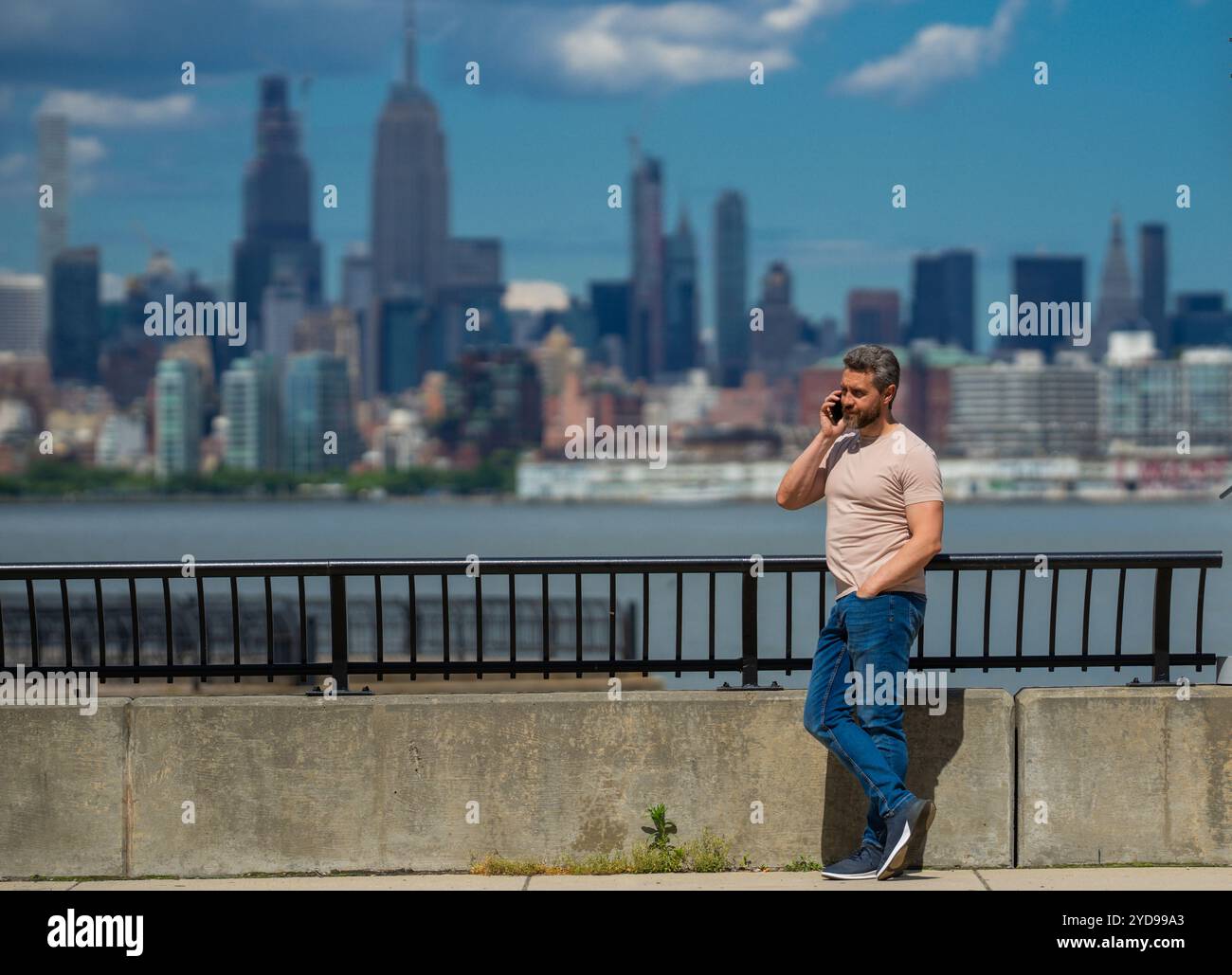 Man talking at the phone in New York City. Man talking on the phone on ...