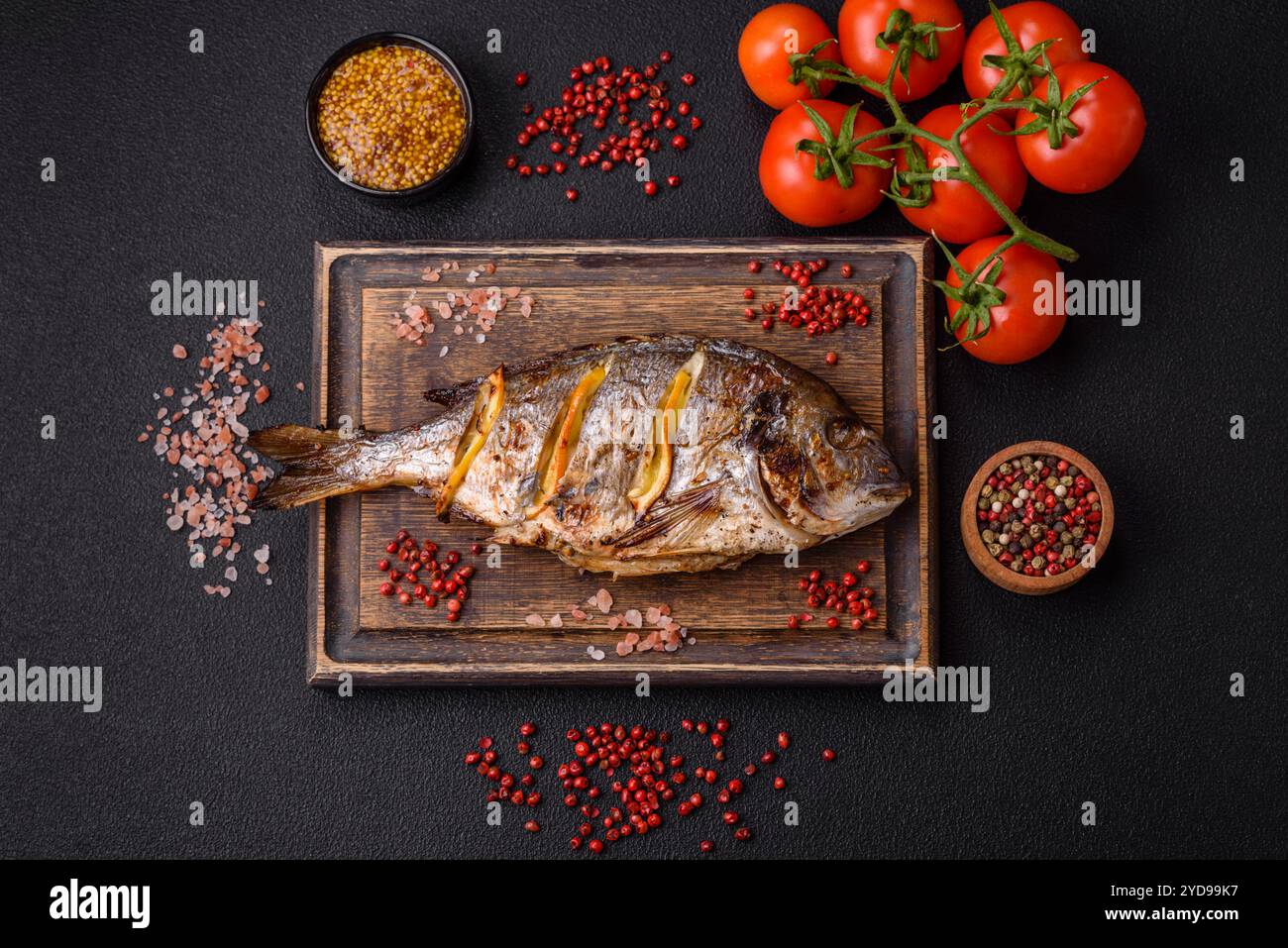 Delicious dorado baked on the grill with salt Stock Photo - Alamy