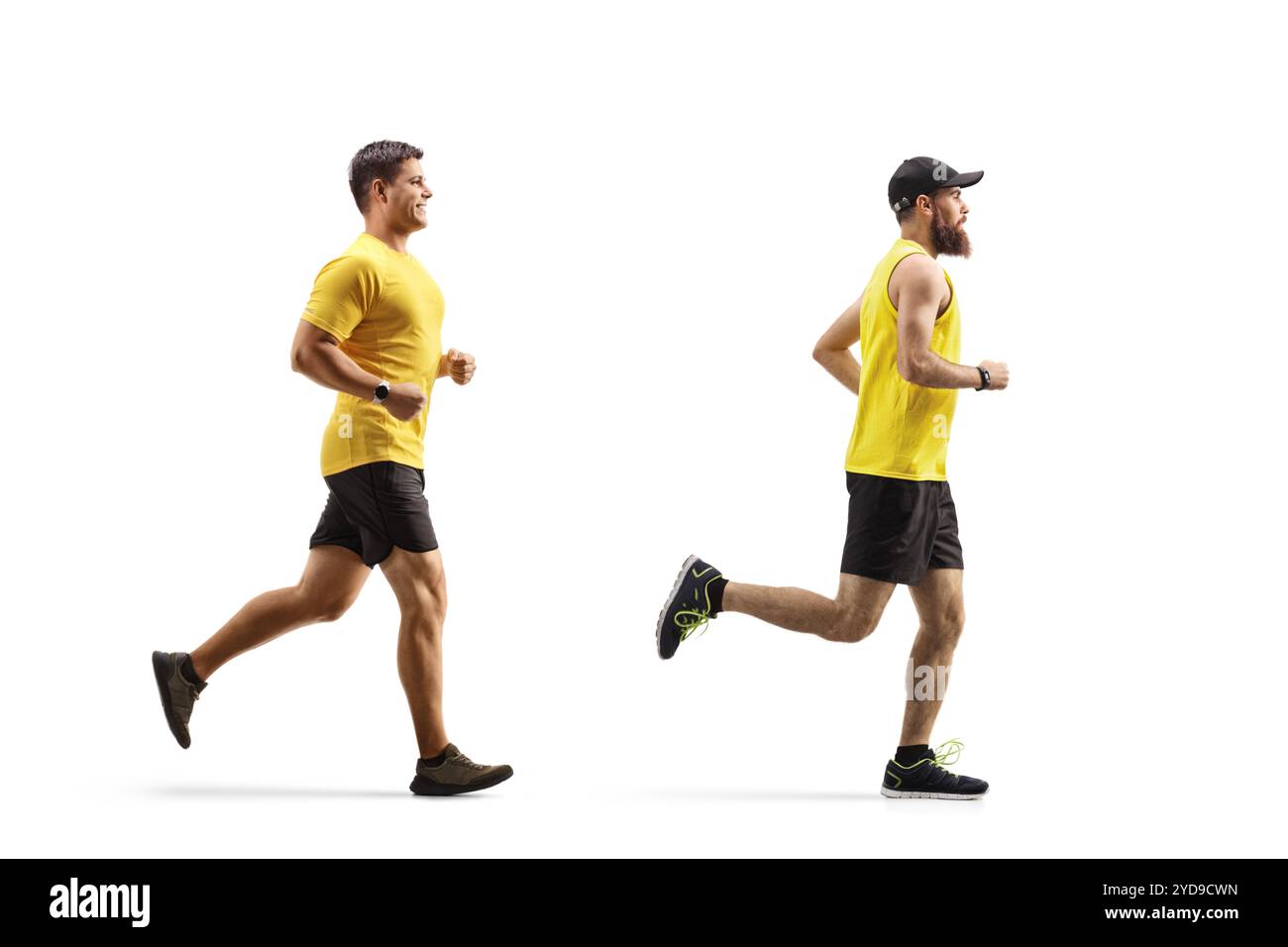 Full length profile shot of two men running in a row isolated on white ...