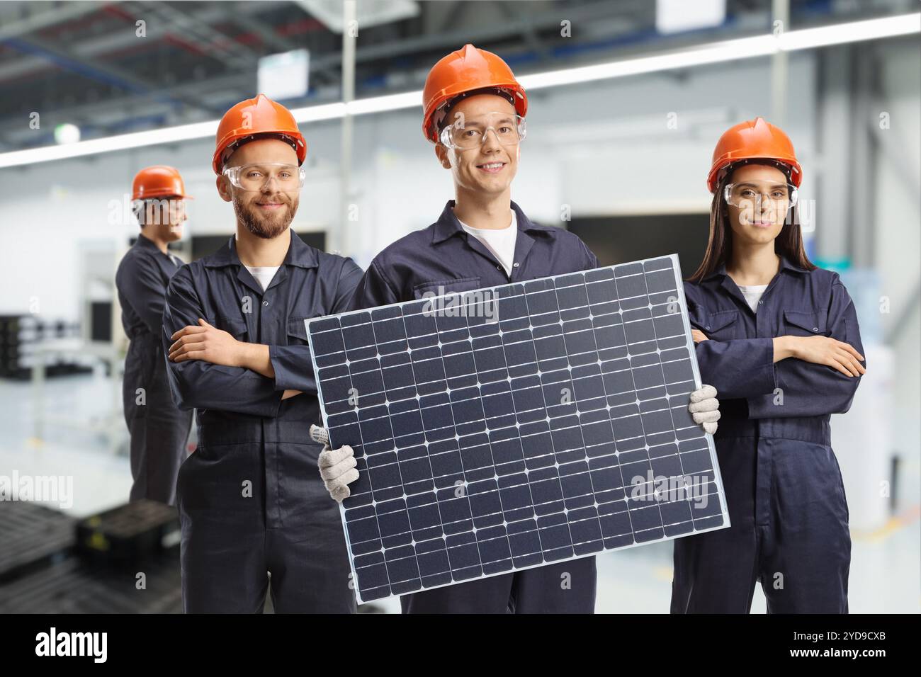 Team of factory workers presenting a solar panel Stock Photo - Alamy