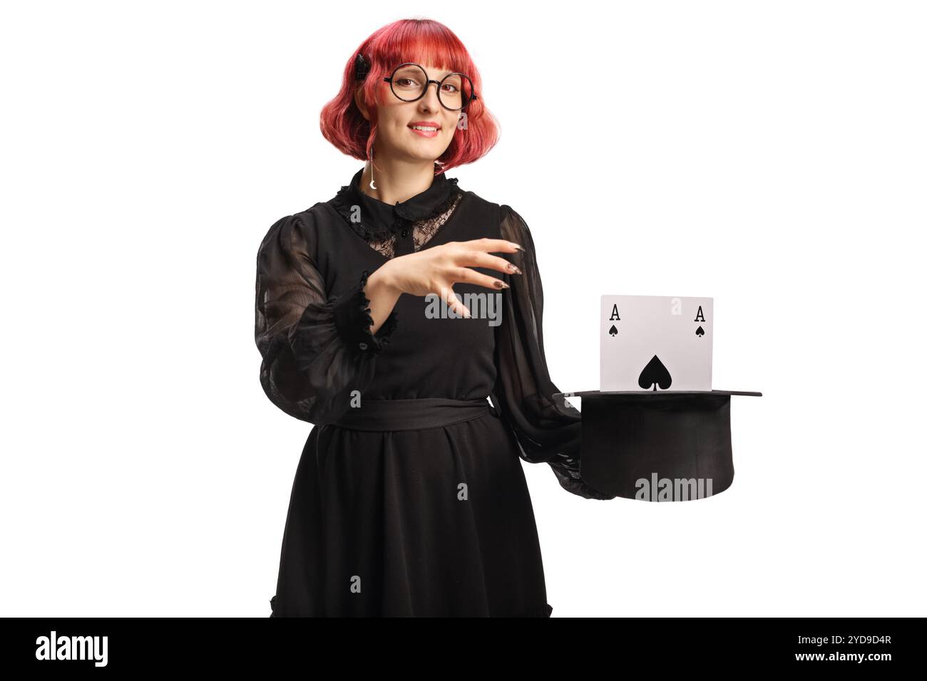 Female magician with a top hat performing a magic trick with an ace ...
