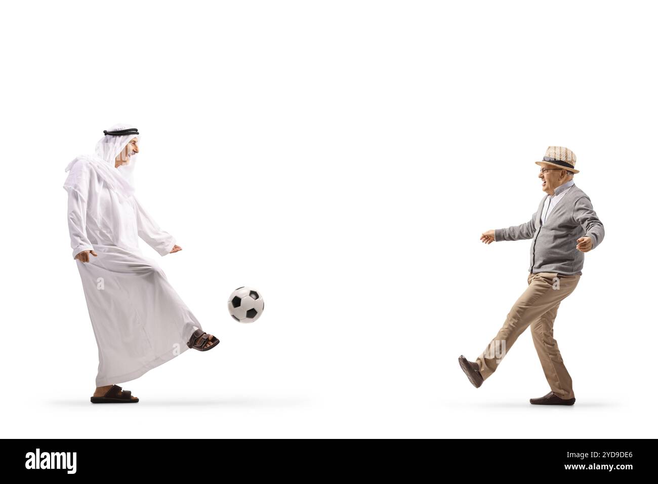 Traditional arab man in ethnic clothes playing football with a senior ...