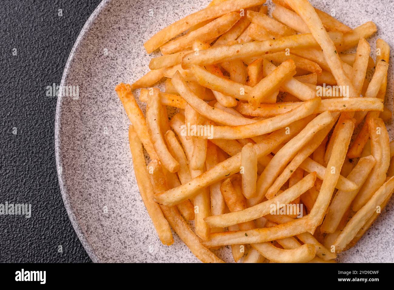 Delicious crispy golden fries with salt and spices Stock Photo - Alamy