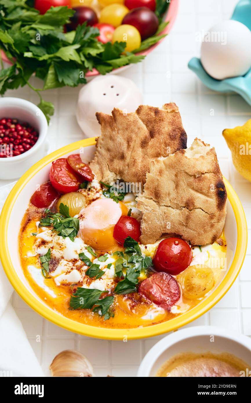 Cilbir or Turkish Eggs in white bowl. Turkish cuisine concept Stock ...