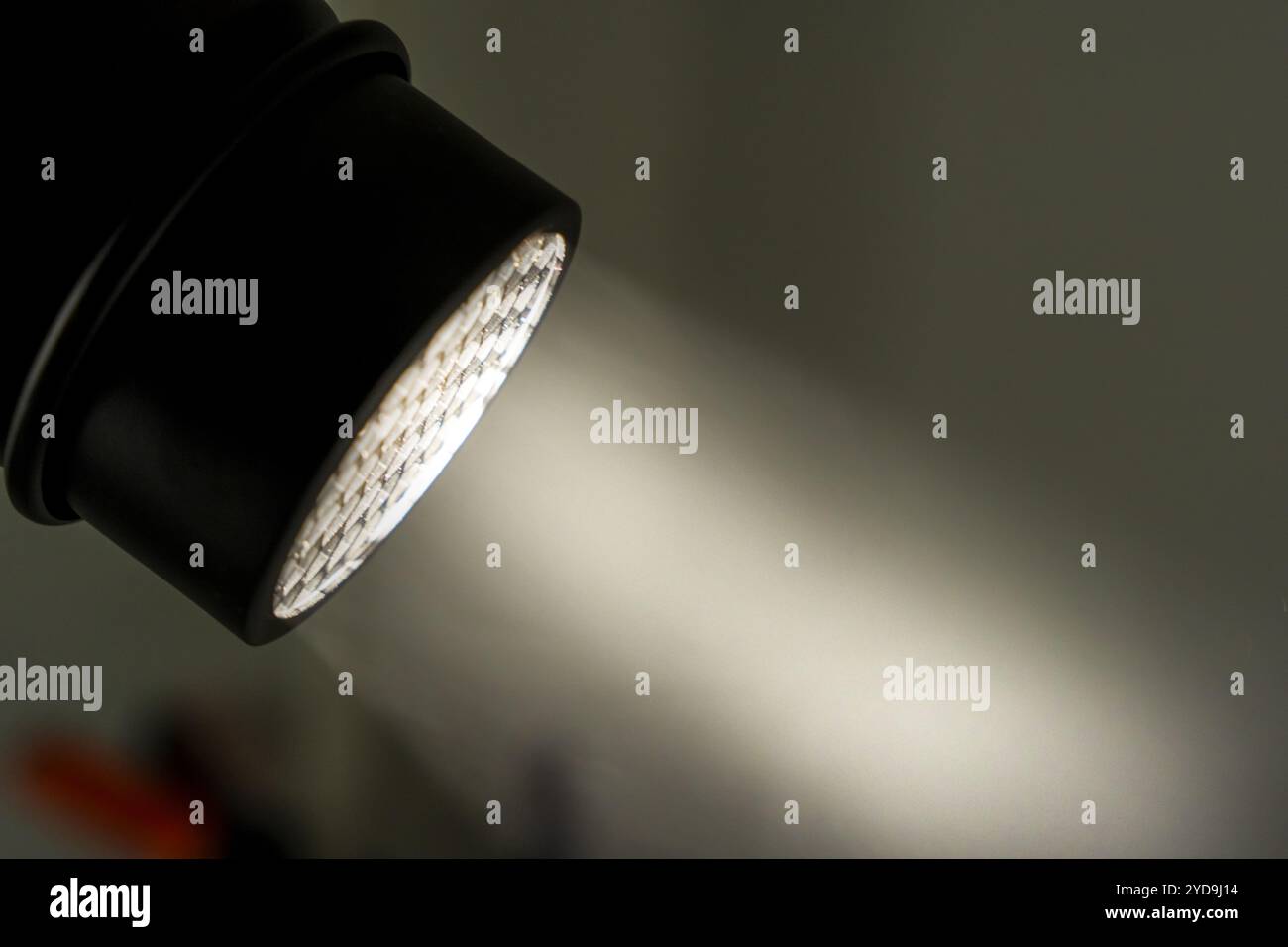 The light falls and creates a bright and focused beam. The light is ...