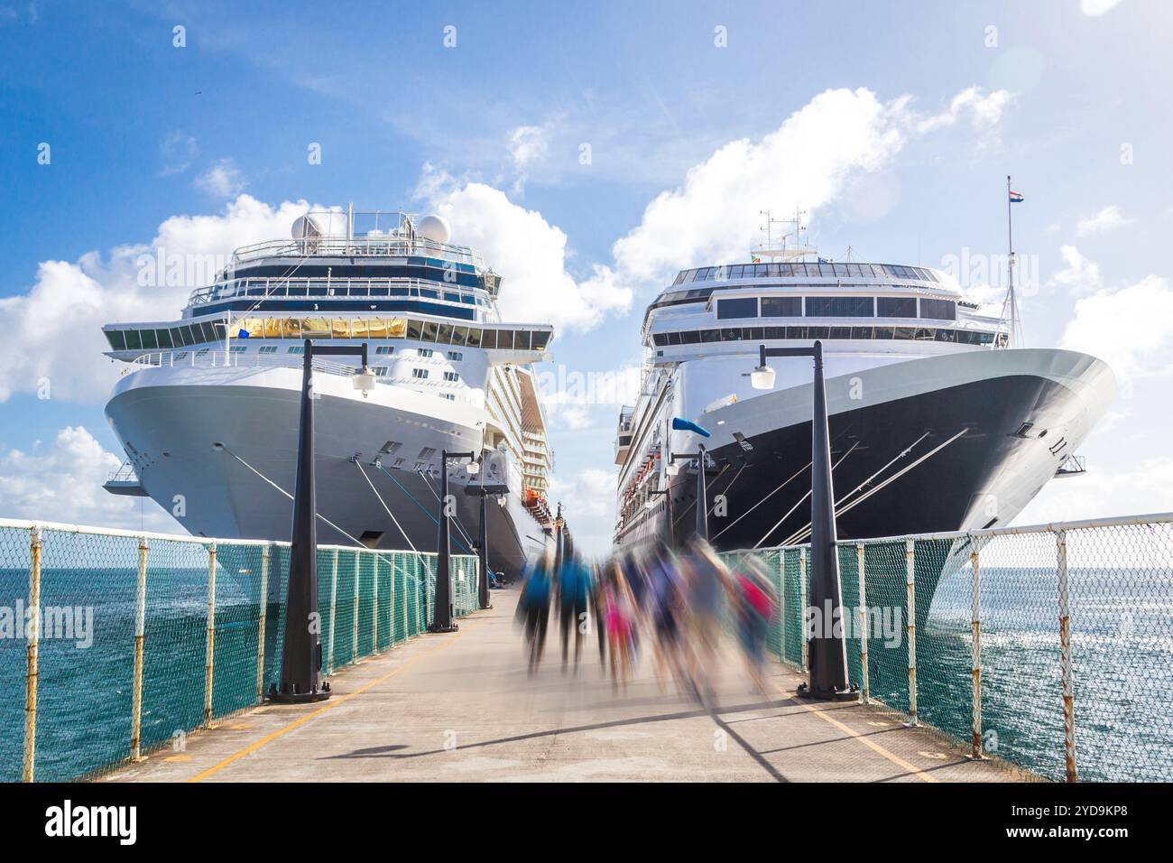 Cruise passengers returning to ship in port with motion blur effect ...