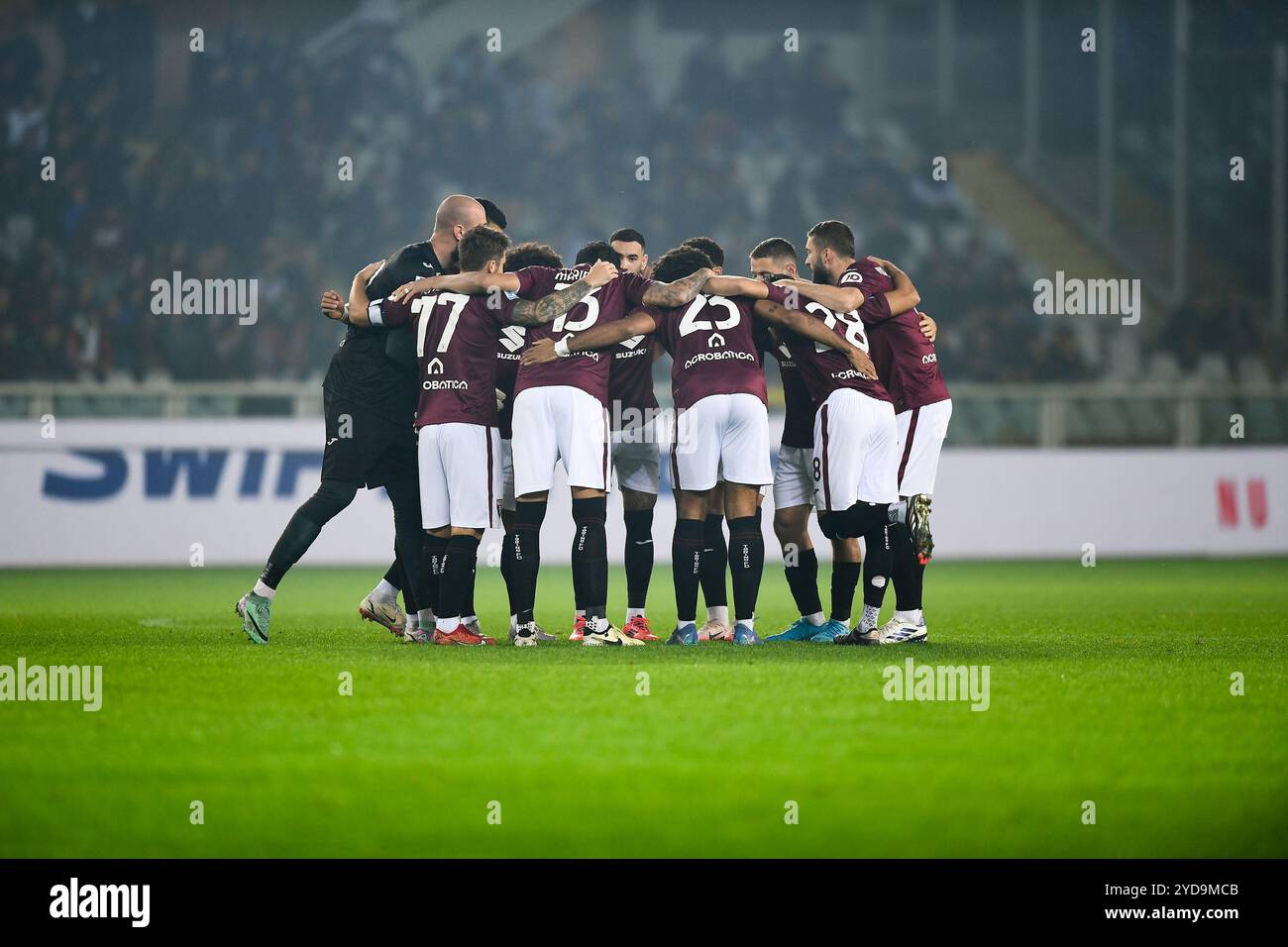 Torino players embrace before the Serie A soccer match between Torino ...