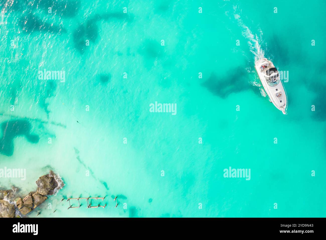 Amazing top view of yacht. Aerial view of luxury floating small ship in ...