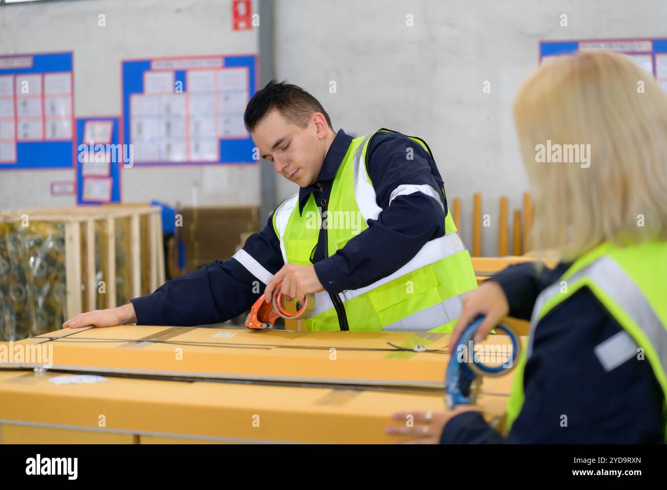 Group of worker in auto parts warehouse Packing small parts in boxes ...