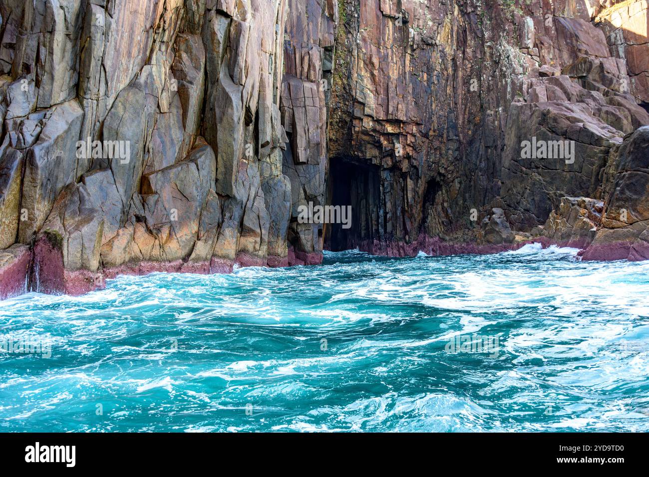 Cave in the cliff over the sea Stock Photo - Alamy