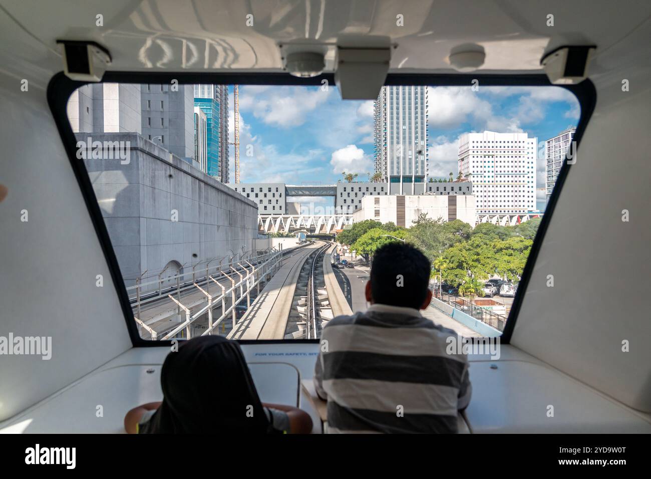 MIAMI - September 10, 2019: Father and son, view from inside of train ...