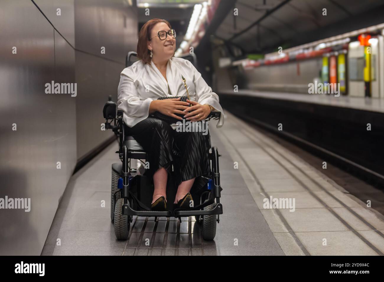 Accessible Metro Station: Wheelchair User Waiting for Train Stock Photo ...