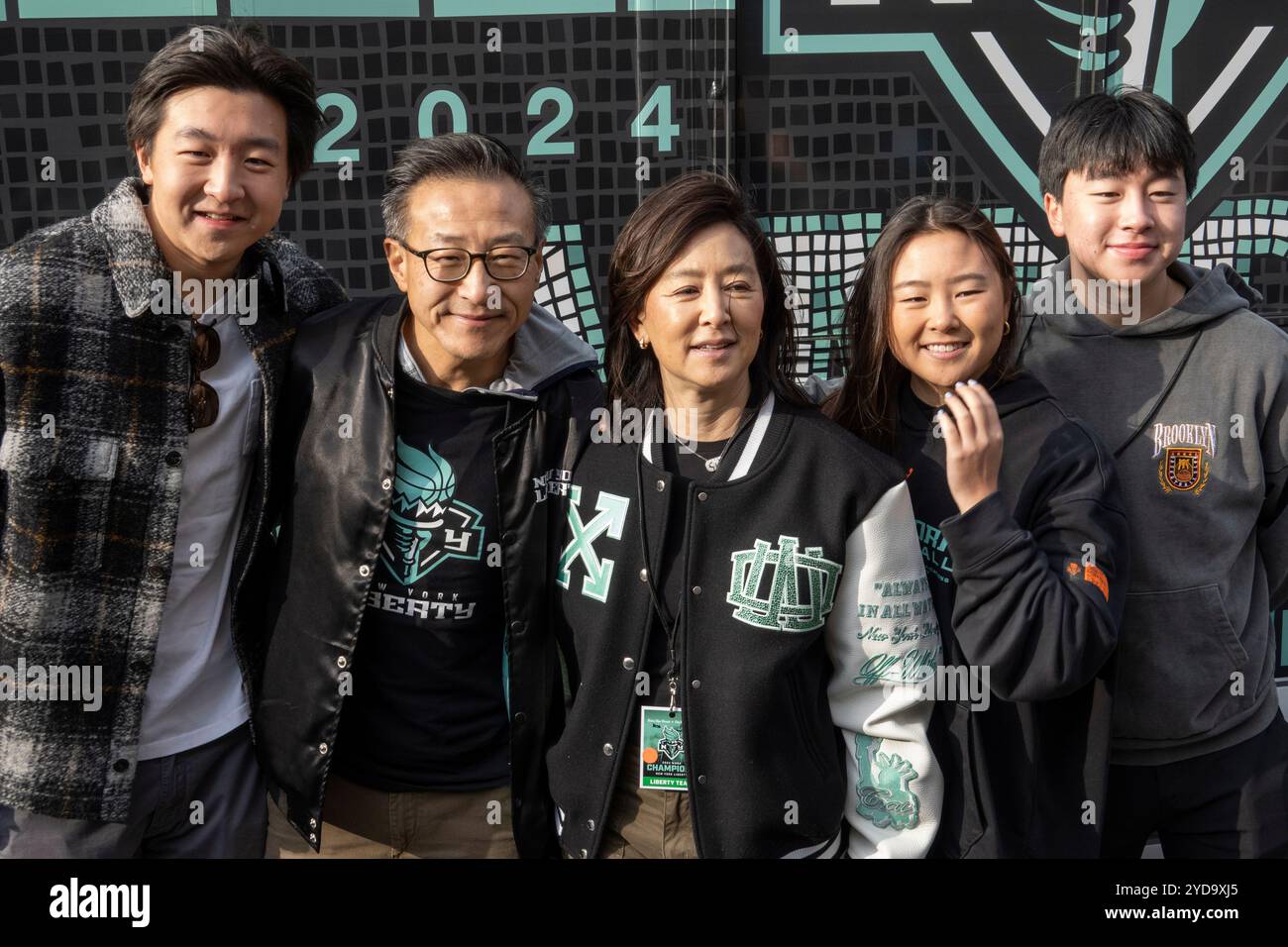 Joe and Clara Wu Tsai with their children are at the victory parade as ...
