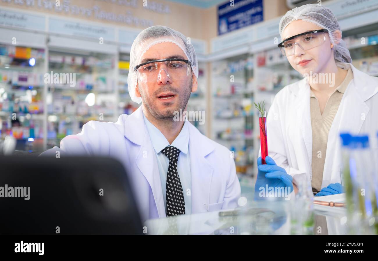 Pharmacist and chemical scientist doing antibiotic trials and testing ...