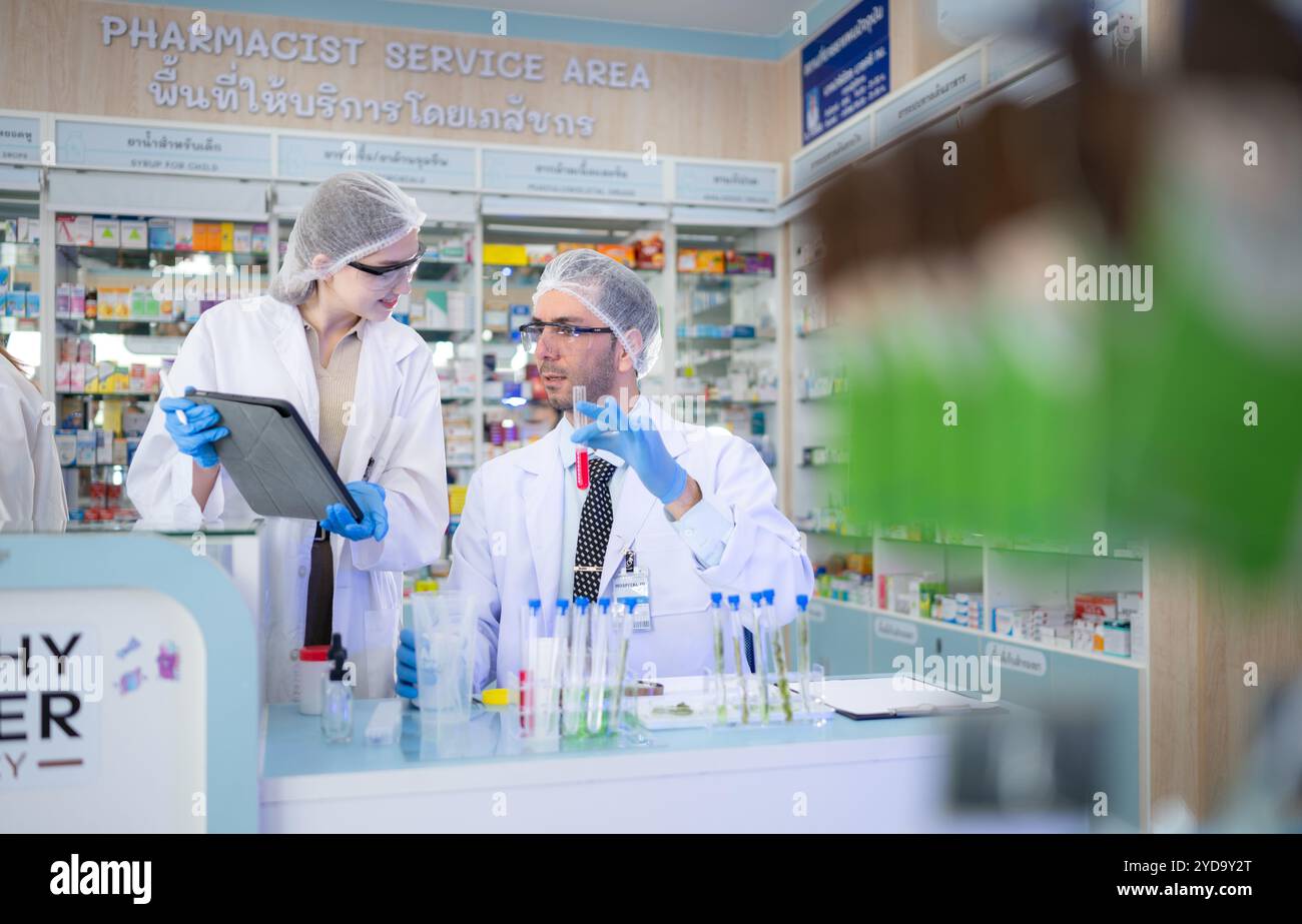 Pharmacist and chemical scientist doing antibiotic trials and testing ...