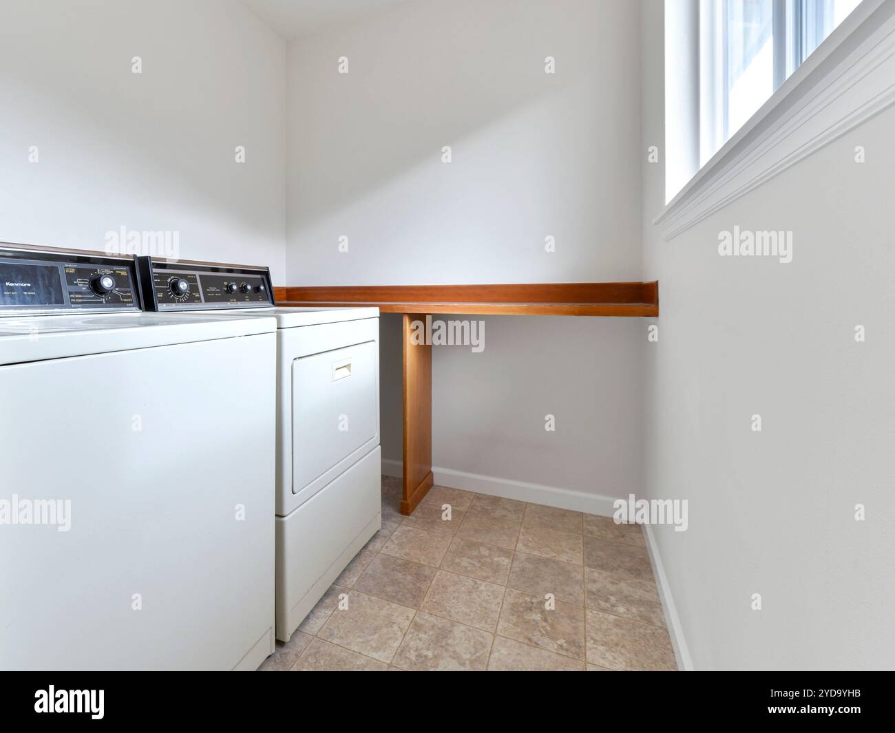 Modern residential laundry room interior Stock Photo - Alamy