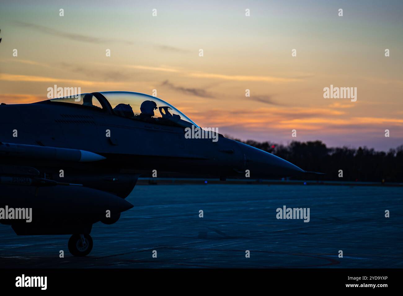 A 114th Fighter Wing F-16 Fighting Falcon being prepared for evening ...