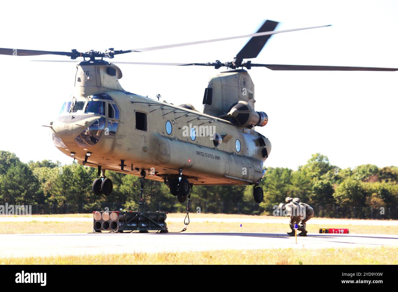 Students in the 89B Ammunition Supply Course work with a Chinook ...