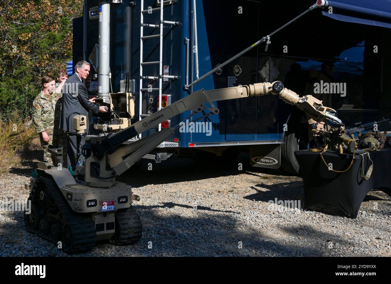 U.S. Rep. French Hill operates a robot with assistance from 19th Civil ...