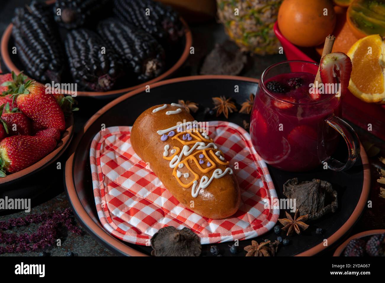 Guagua de pan with cup of colada morada, traditional Ecuadorian food ...