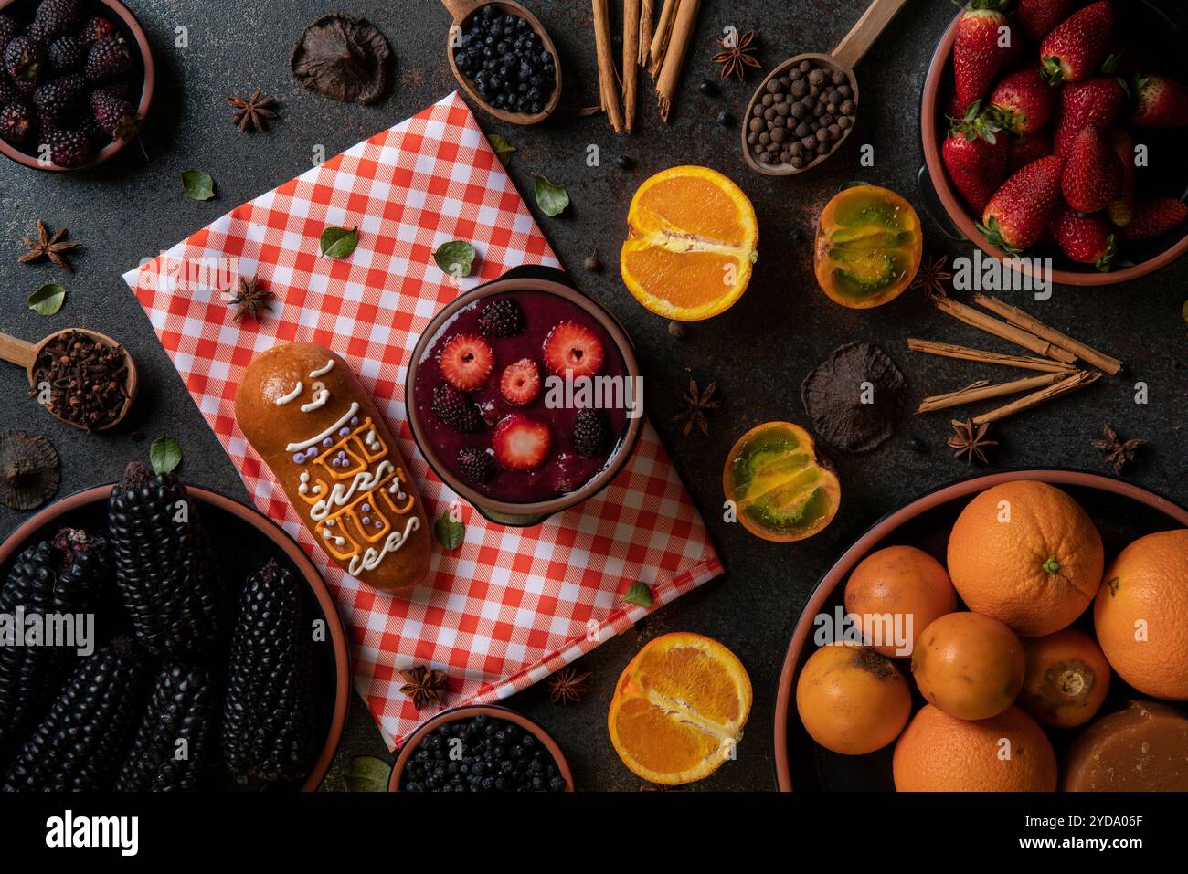 Top view of Guagua de pan with cup of colada morada, traditional ...