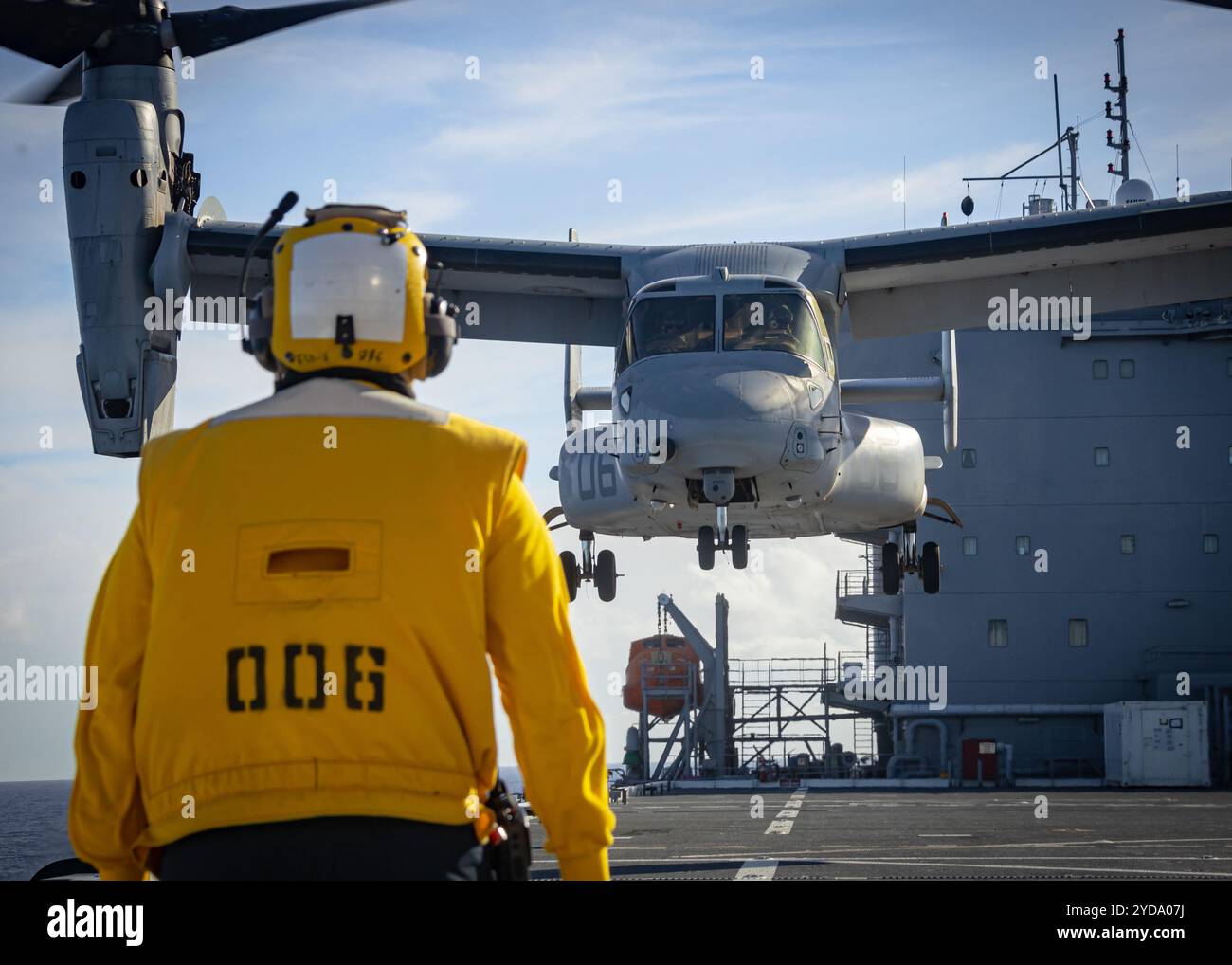 A U.S. Navy Sailor attached to the Expeditionary Sea Base (ESB) 6 USS John L. Canley watches a U ...